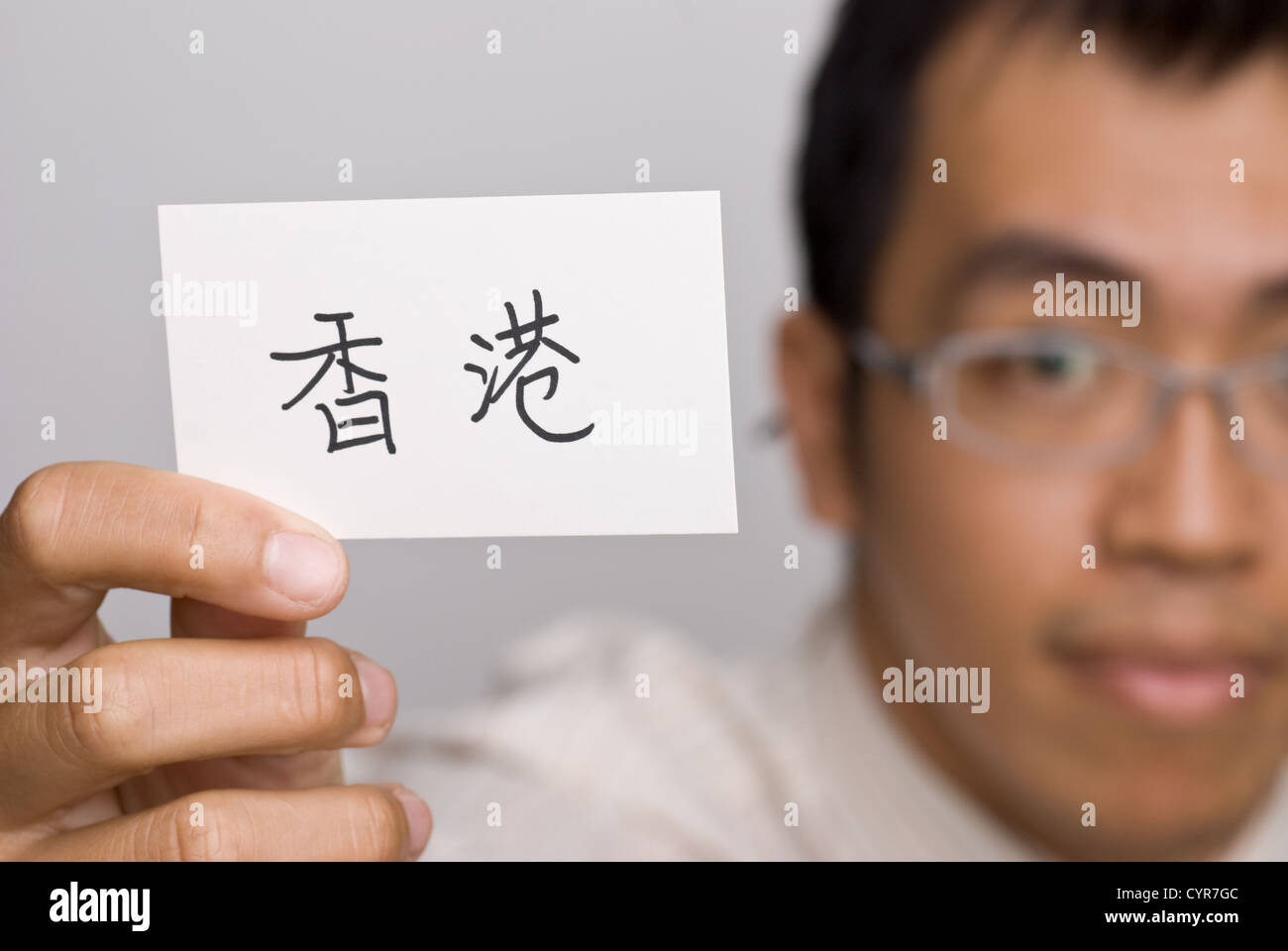 Business man travel to Hong Kong for work. Card write on Chinese words ...