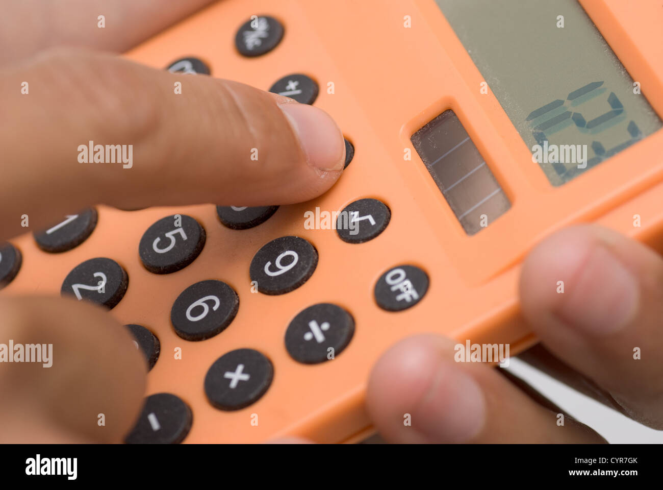 Business man use calculating machine with finger Stock Photo - Alamy