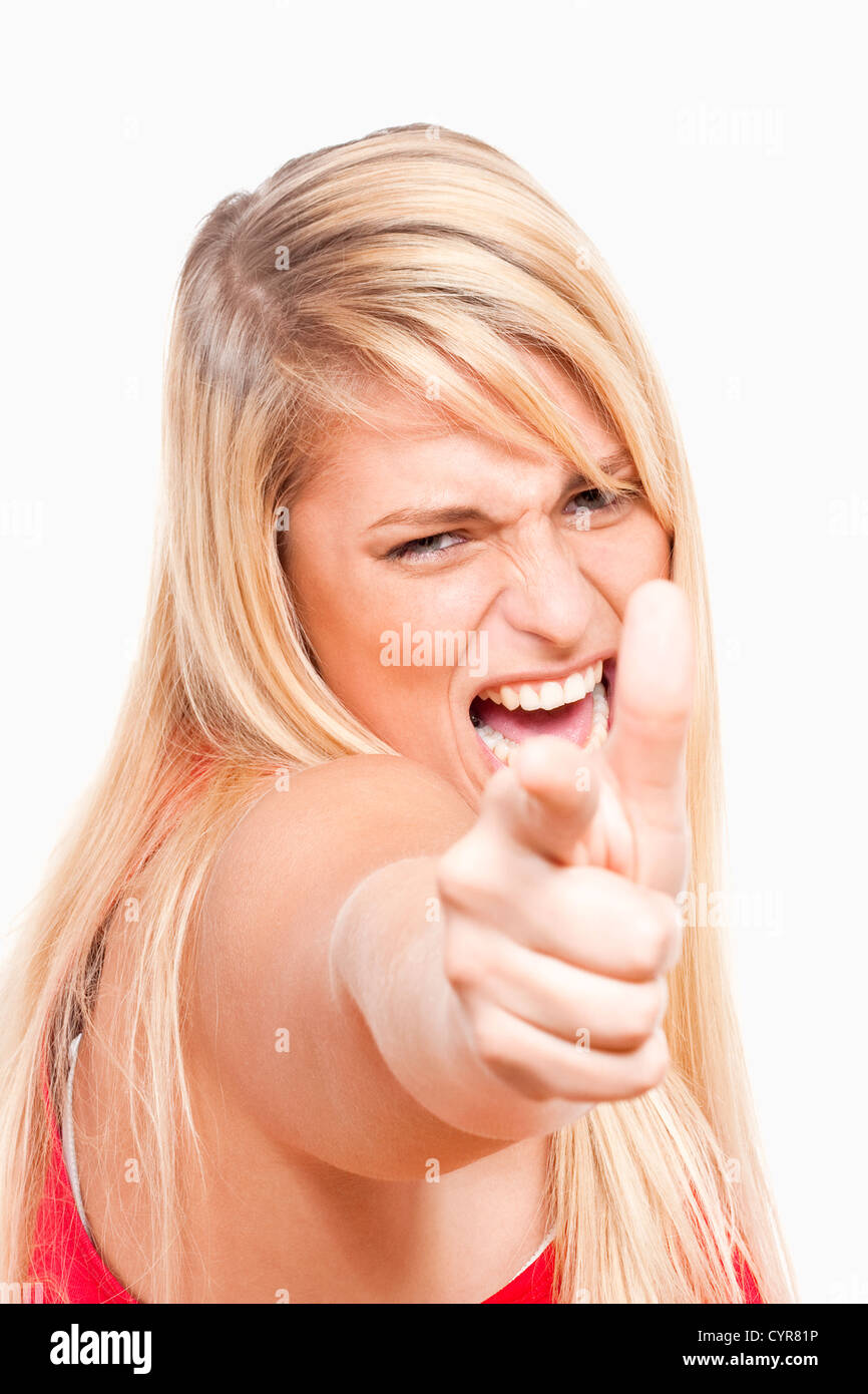 angry young woman pointing her finger at the camera - isolated on white Stock Photo - Alamy