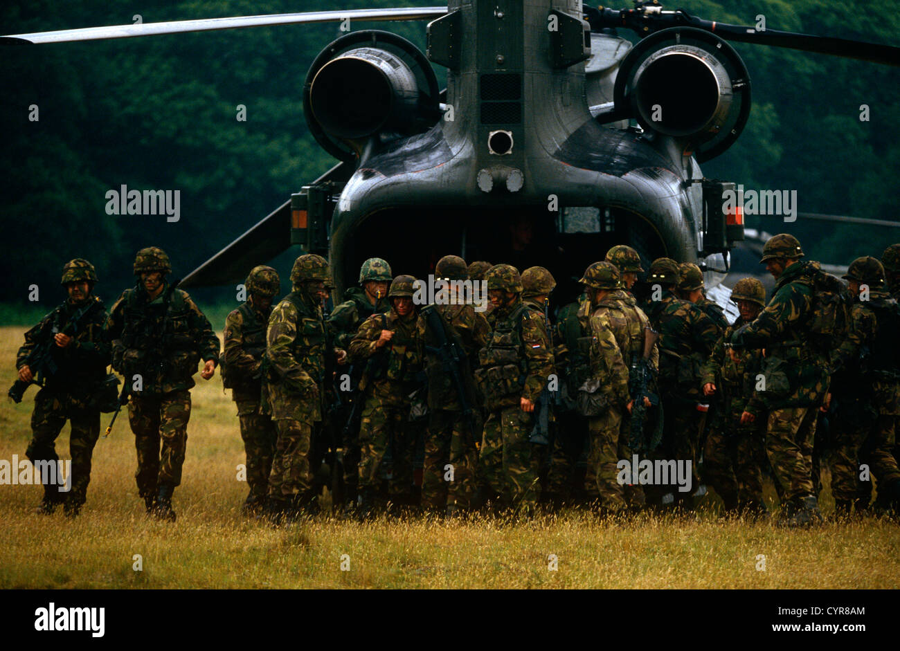 German troops are ready to embark into a stationary Chinook helicopter ...