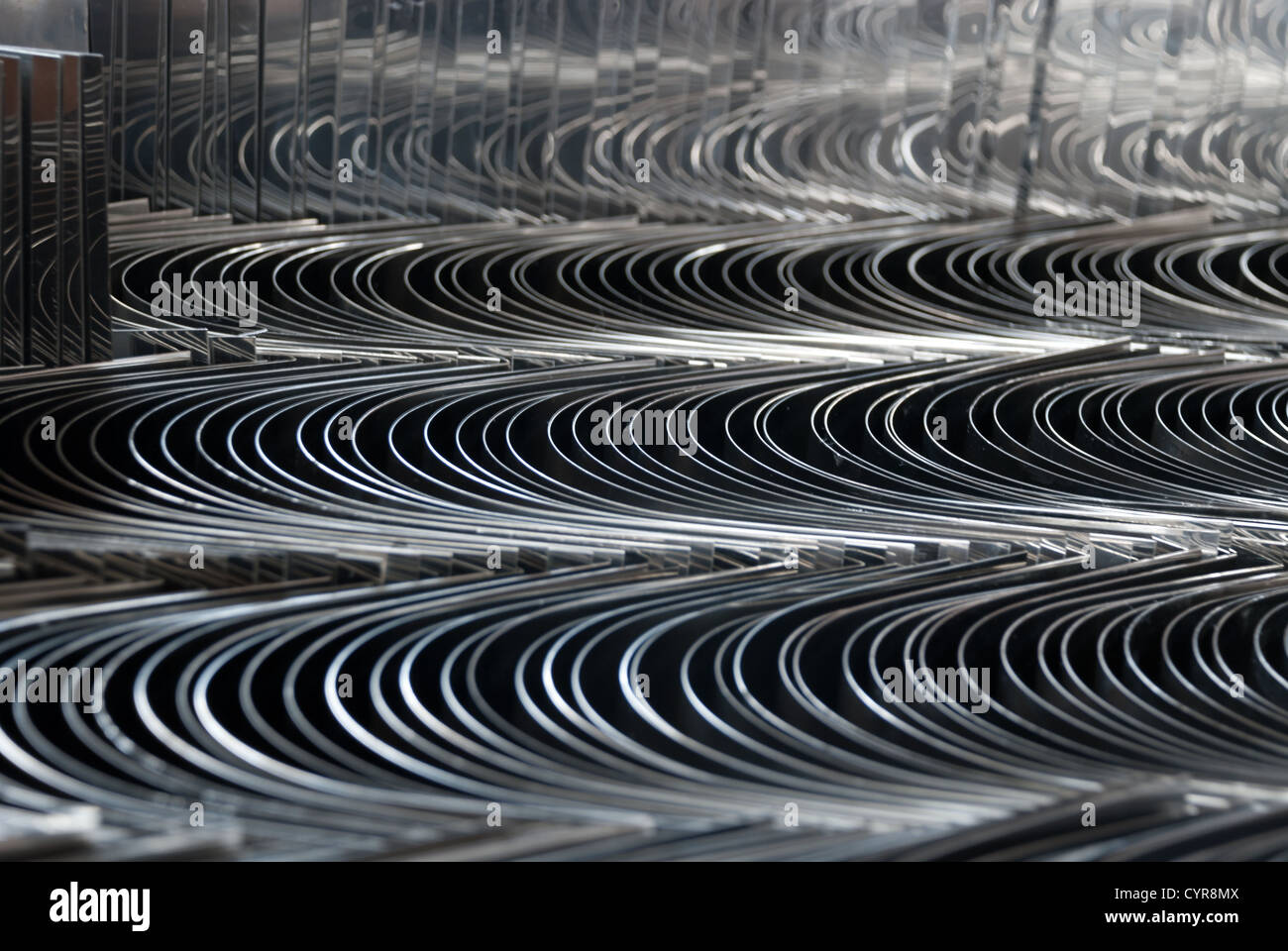 pieces of steel shaped with wave pattern Stock Photo - Alamy