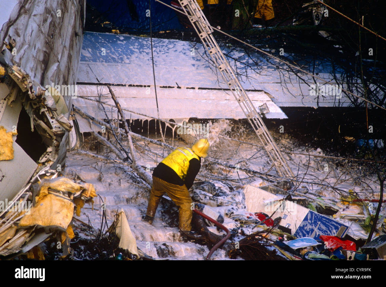 Emergency crews and the devastated fuselage of a British Midland ...