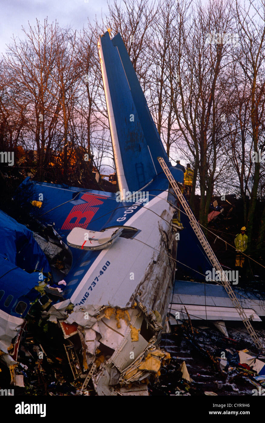 Emergency crews and the devastated fuselage of a British Midland ...