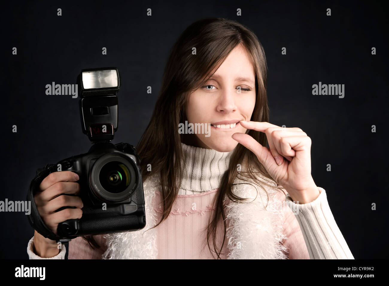 Pretty photographer with a professional camera and flash Stock Photo ...