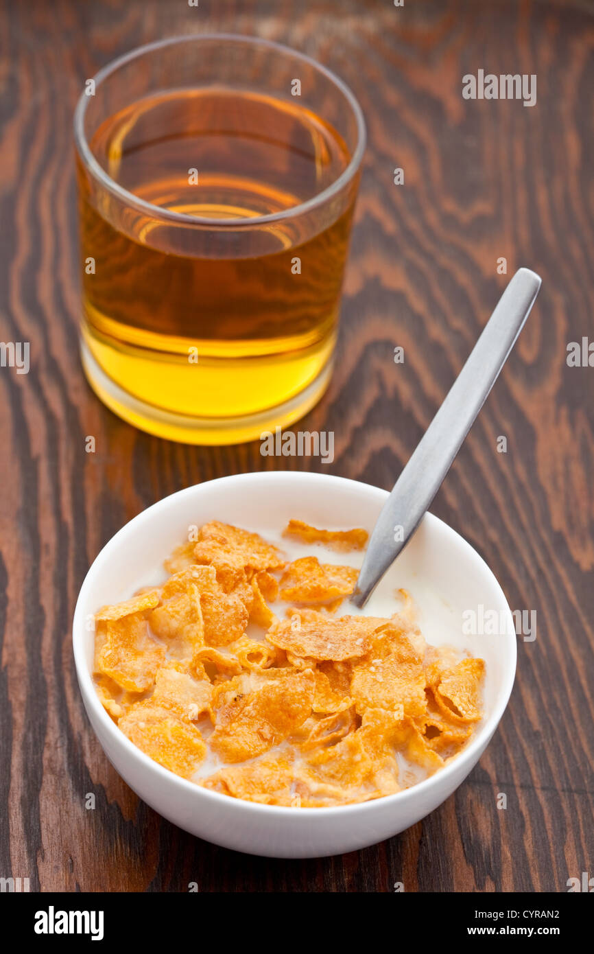 Breakfast cereal with milk and fresh apple juice Stock Photo - Alamy