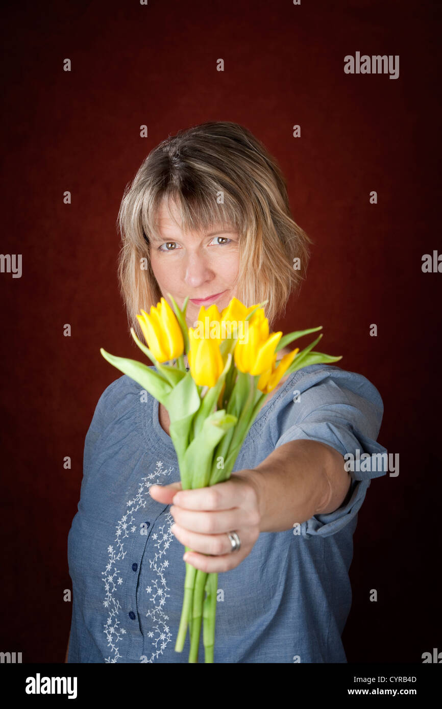 Dutch lady with tulips hi-res stock photography and images - Alamy