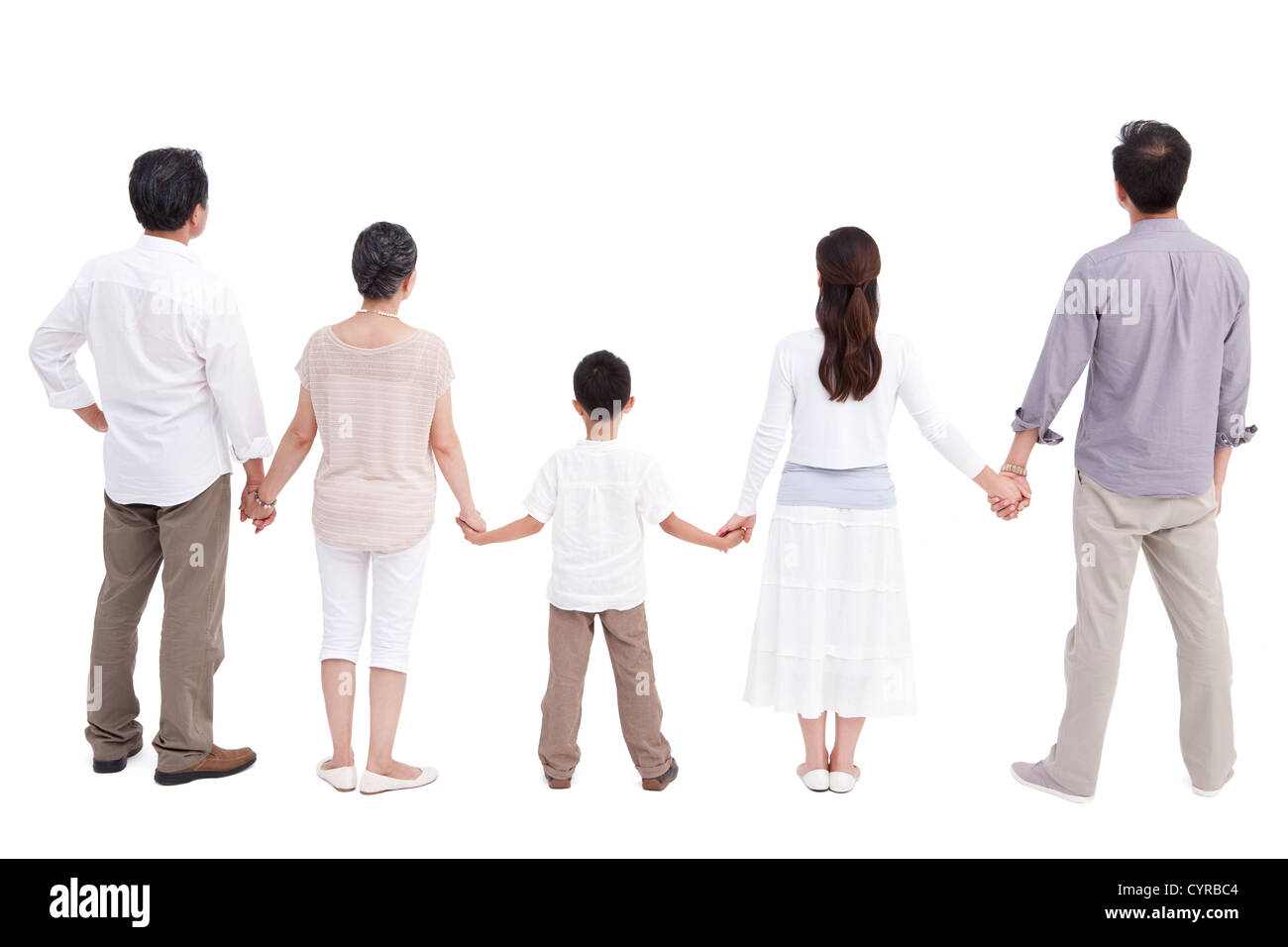 Family looking at view, rear view Stock Photo - Alamy