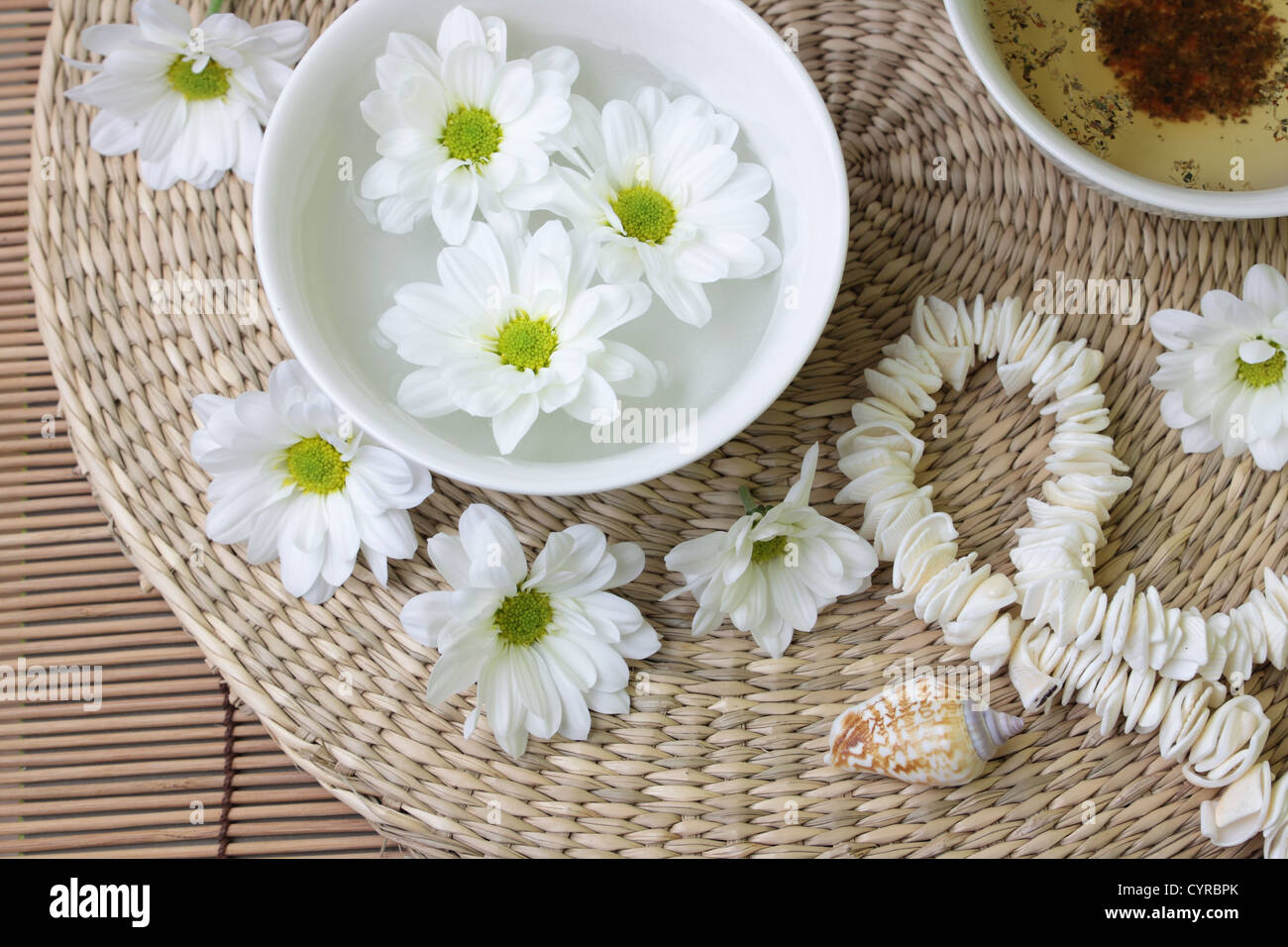 Spa design with herb and daisy Stock Photo - Alamy