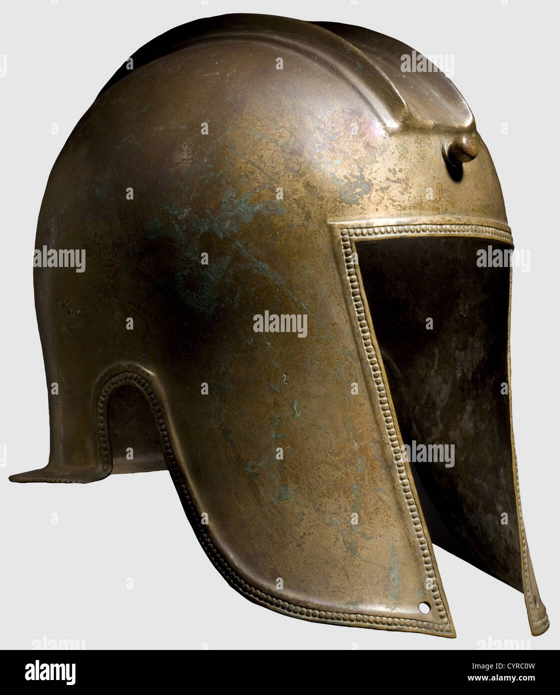 An Illyrian type helmet,Southeast Europe,5th century B.C. Bronze skull embossed in one piece ...