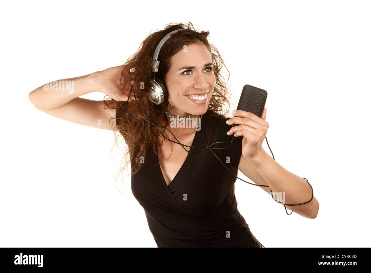 Pretty woman on white with handheld audio device Stock Photo - Alamy