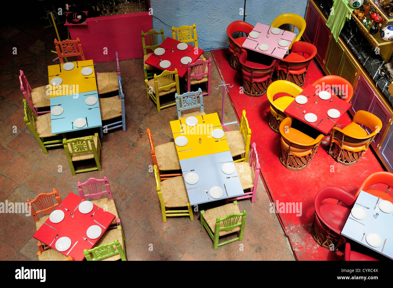 Elevated view looking down on tables in colourful restaurant interior ...