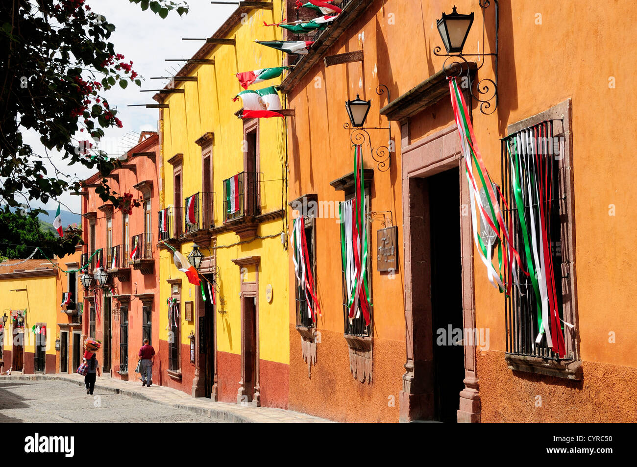Independence Day decorations adorn colonial street lined with brightly ...