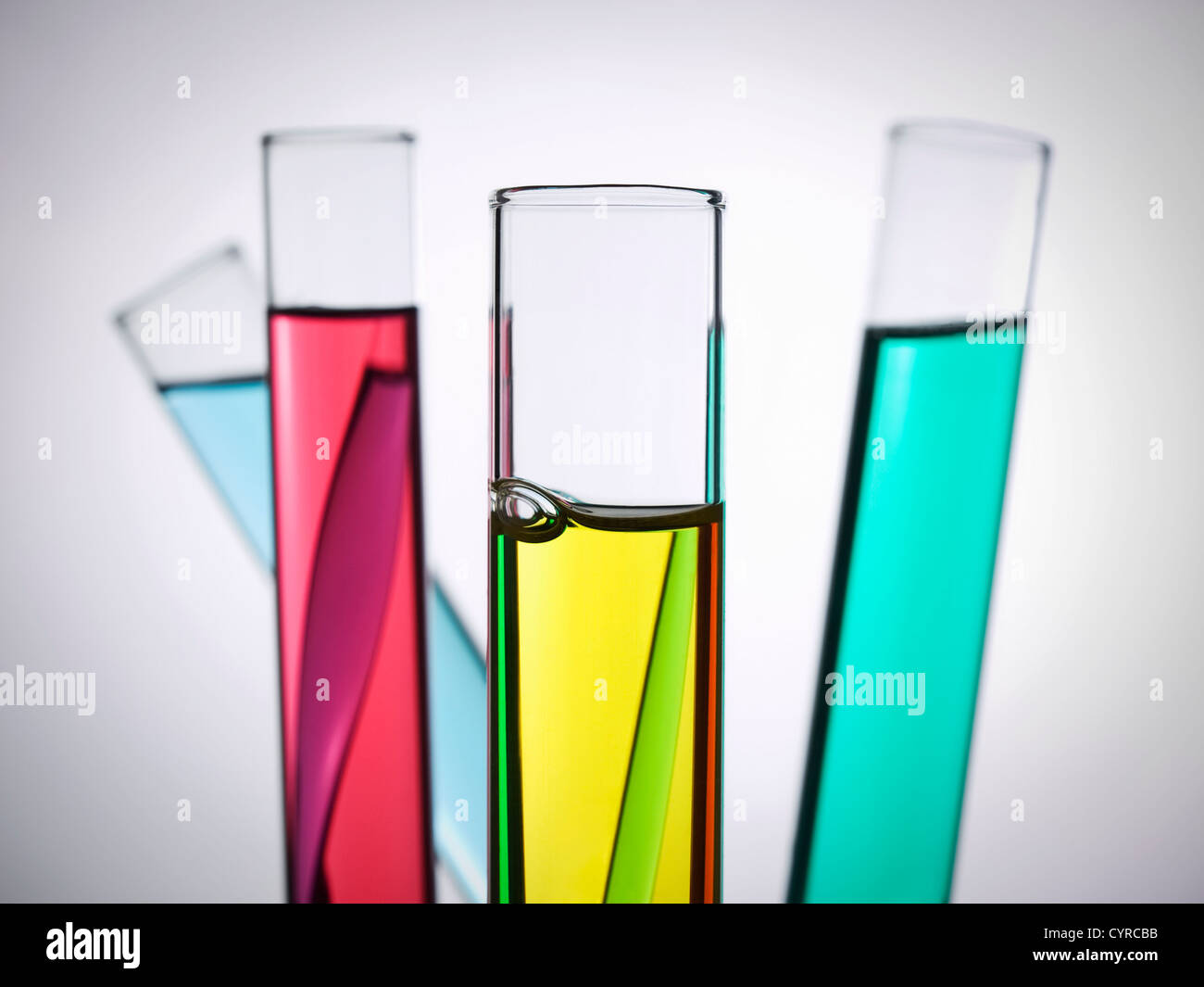 Four test tubes filled with colored liquids Stock Photo - Alamy