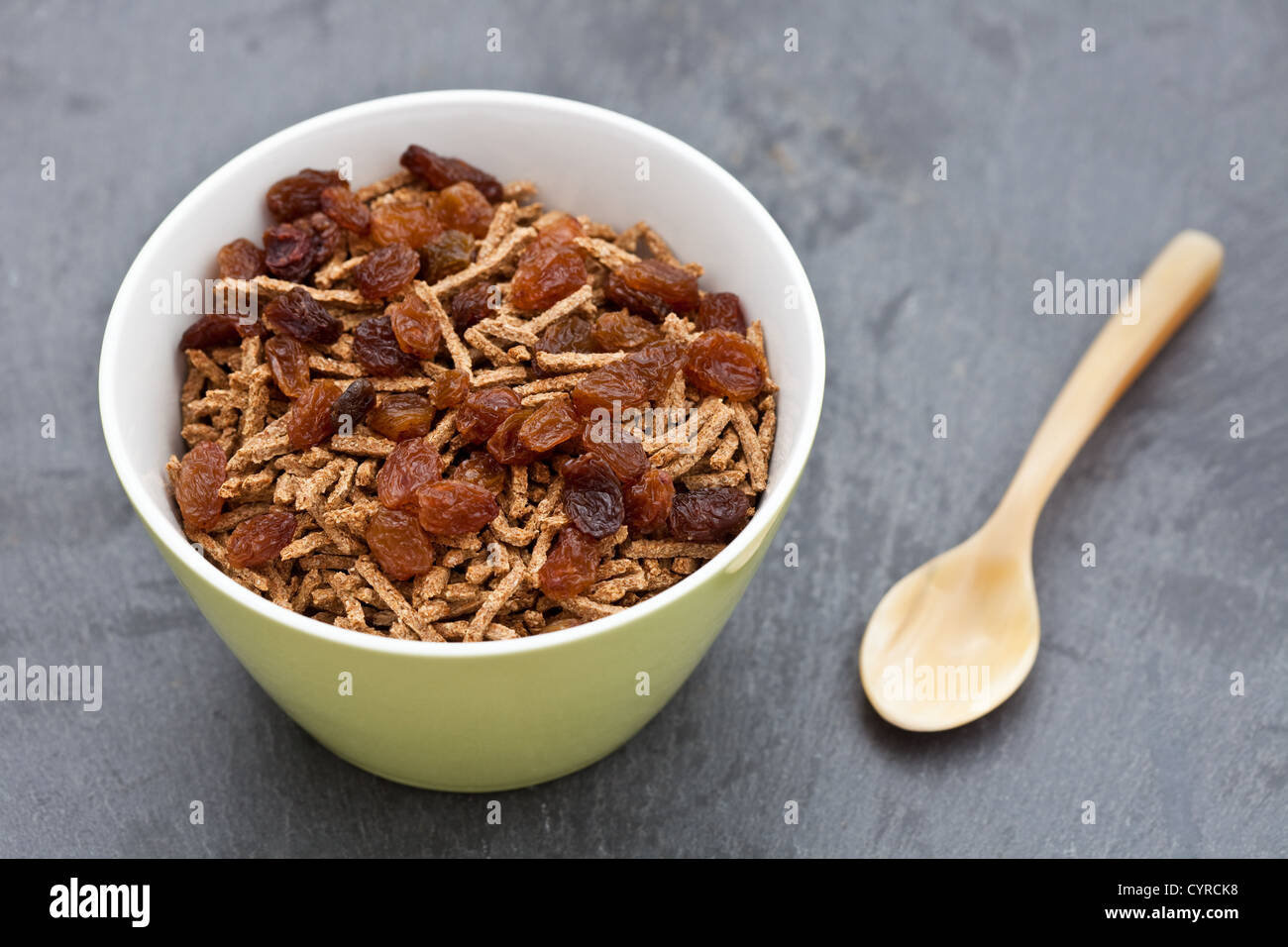Bran breakfast cereal with sultanas in a green bowl Stock Photo - Alamy