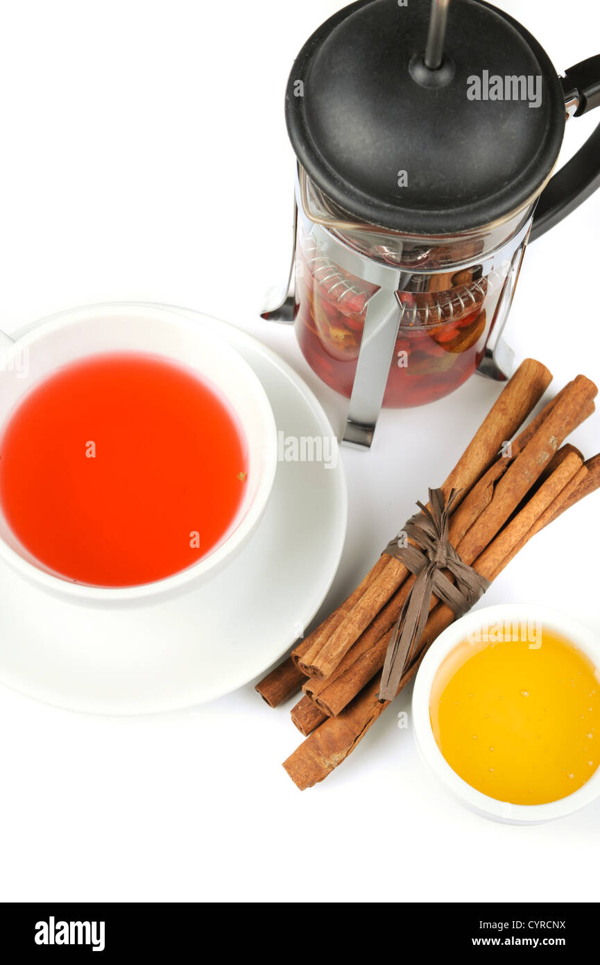 Cup of hot berries tea with cinnamon sticks, and honey Stock Photo - Alamy