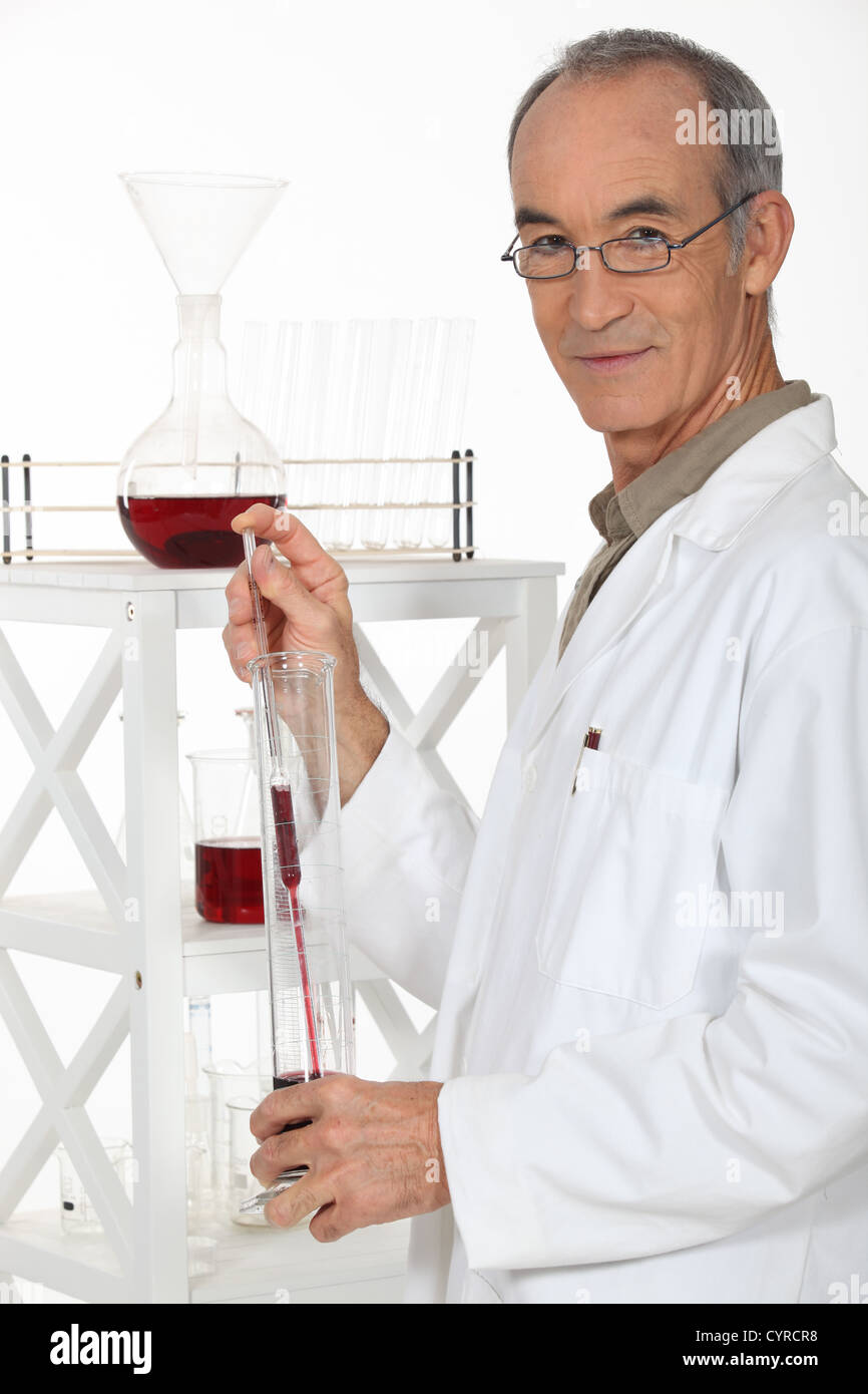 Scientist mixing chemicals in test hi-res stock photography and images ...