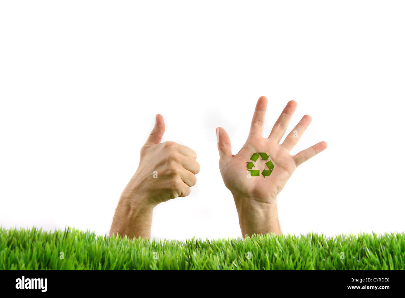 Hands in the grass on white background Stock Photo - Alamy