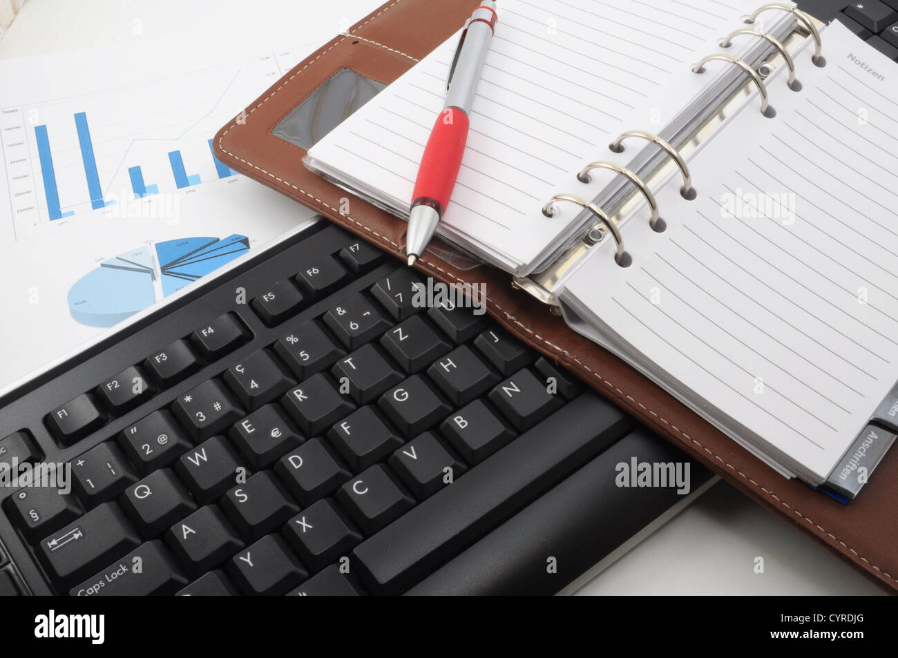 computer keyboard and organizer with pan in business office Stock Photo ...