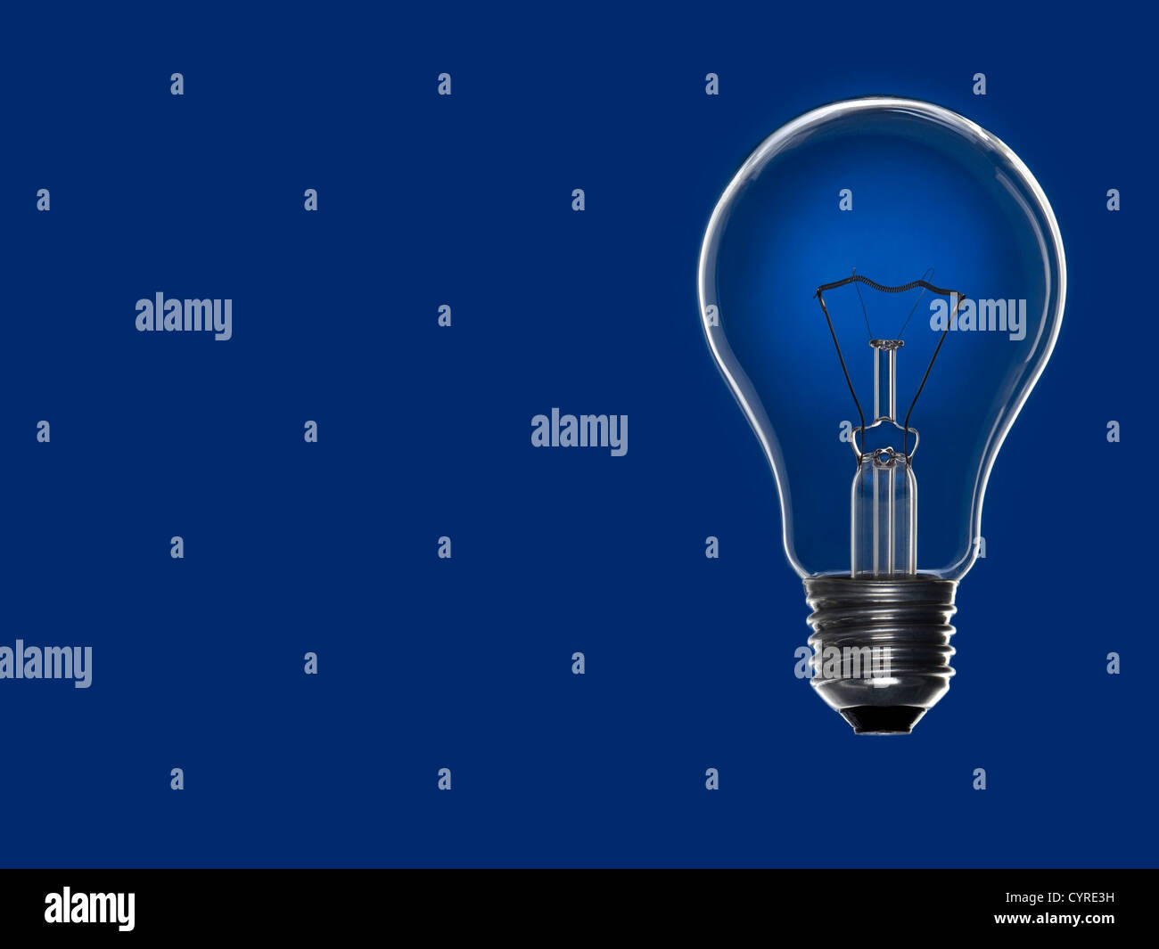 Turned off light bulb over a blue background. Copy space Stock Photo ...