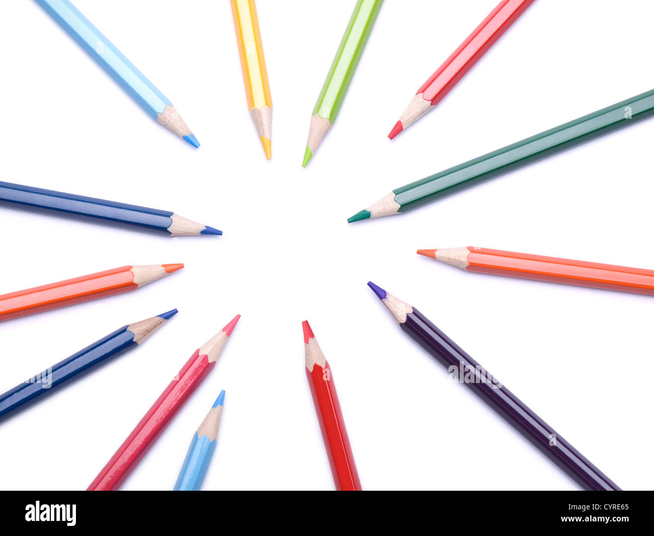 Several color pencils pointing at the same empty spot Stock Photo - Alamy