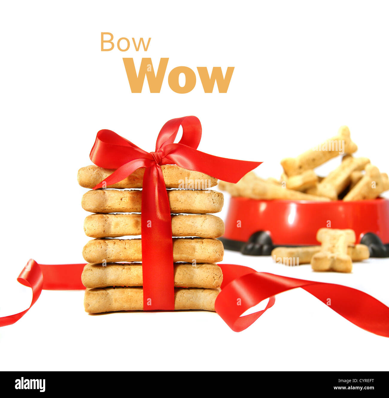 Dog biscuits wrapped with red bow on white background Stock Photo - Alamy