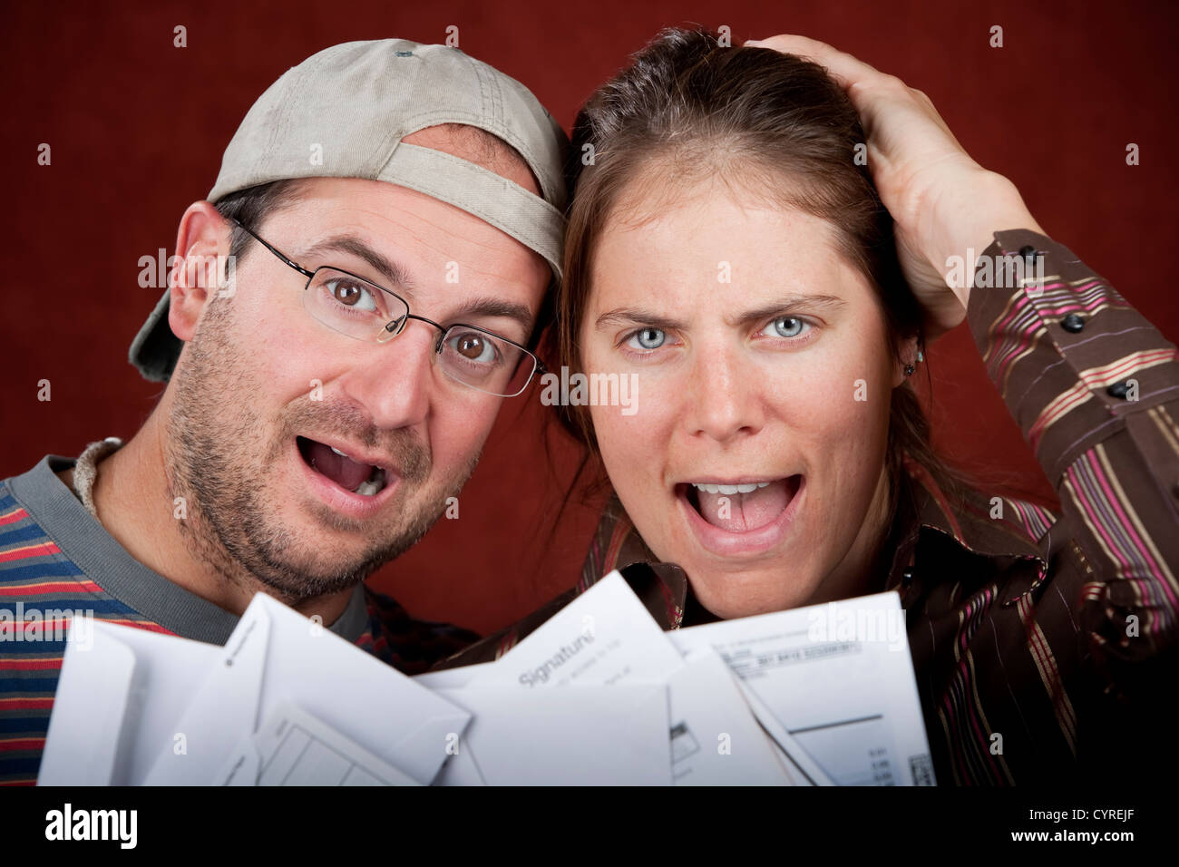 Young couple upset over too many bills Stock Photo - Alamy