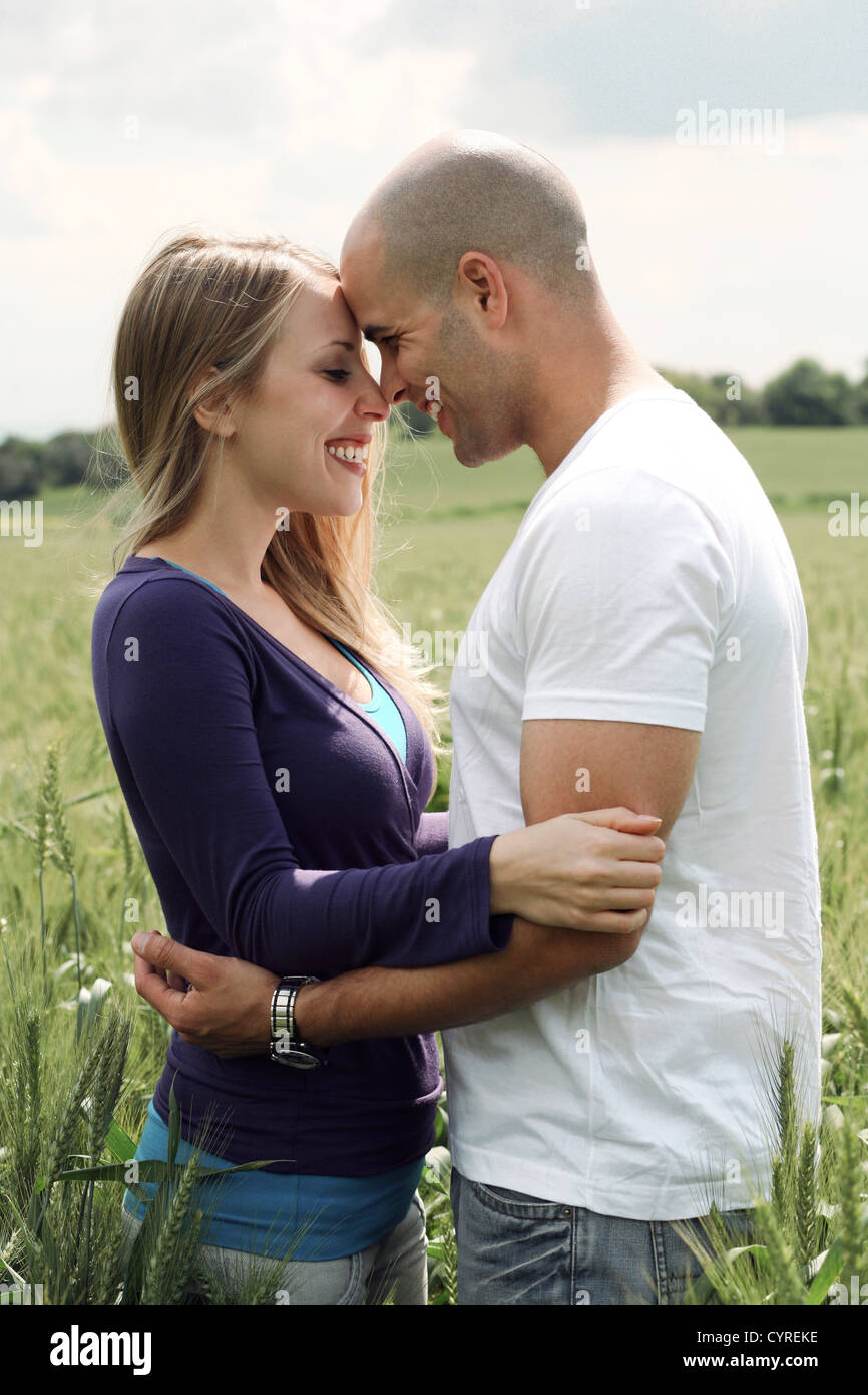 Couple getting close in romance, outdoors Stock Photo - Alamy