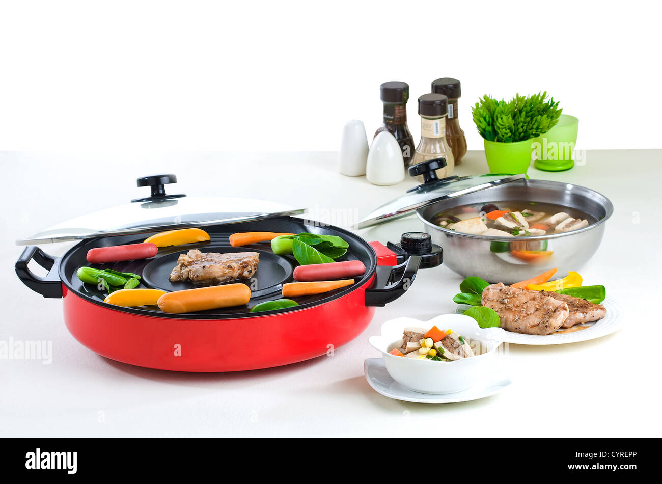 Electric barbecue and cooking pot a useful kitchenware Stock Photo - Alamy