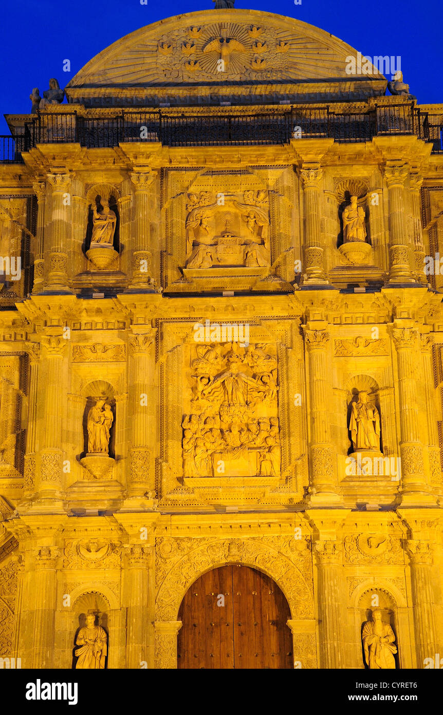 Part view of baroque exterior facade of cathedral at night with relief ...