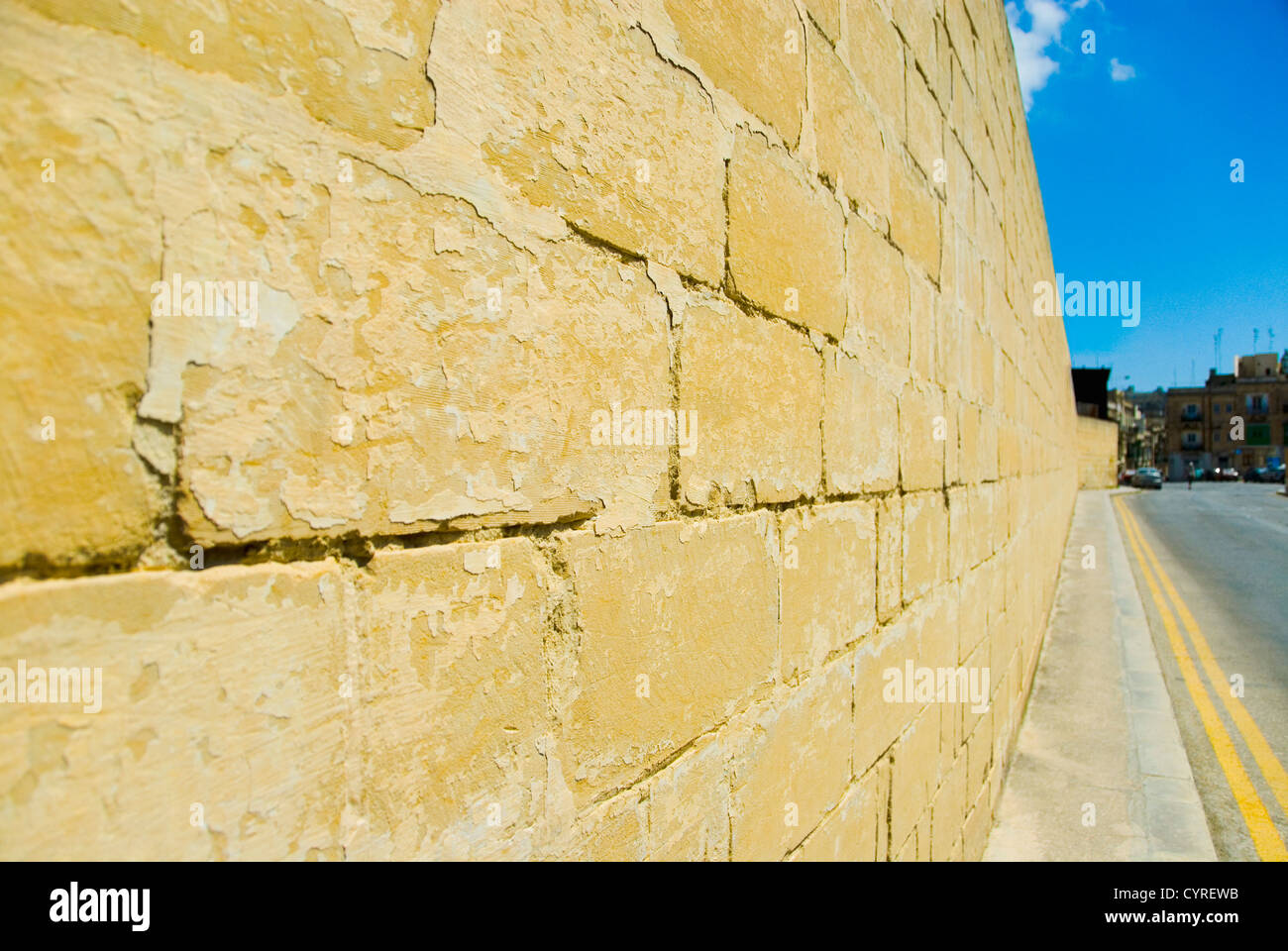Stone wall along the road, Valletta, Malta Stock Photo - Alamy