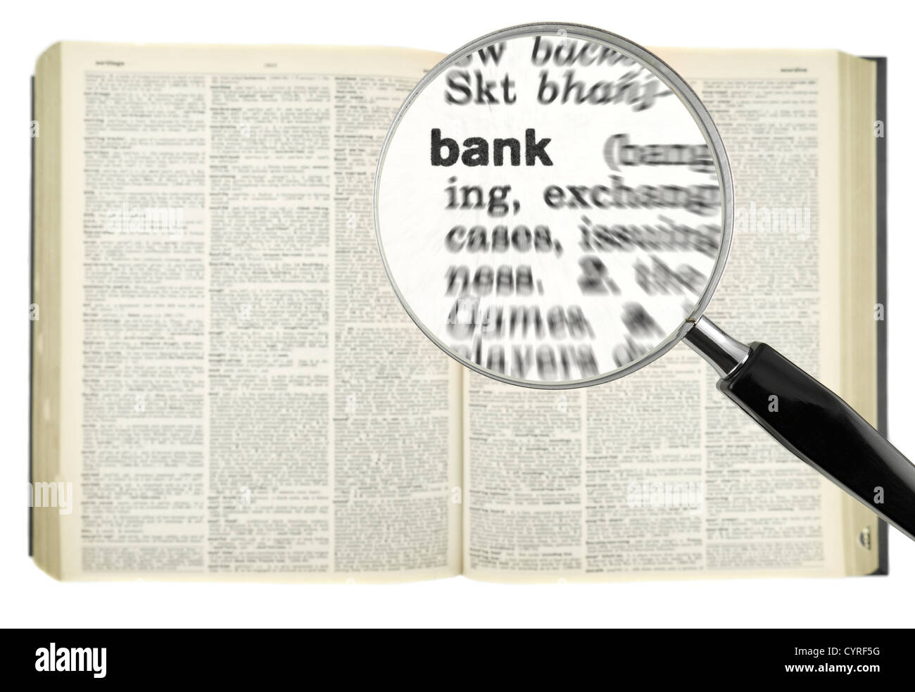 A magnifying glass on the word BANK on a dictionary Stock Photo - Alamy