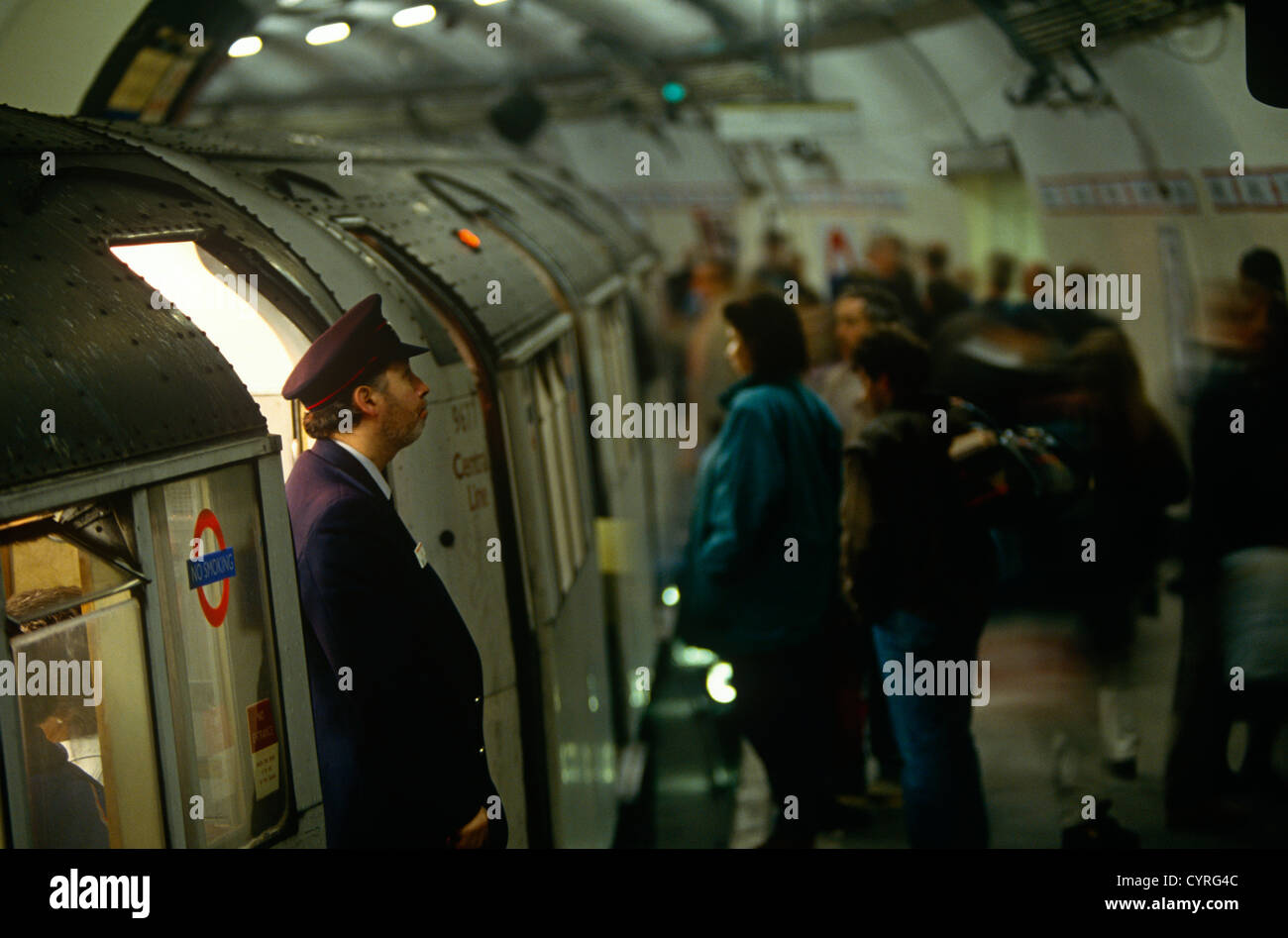 Train guard attends top departure on morning rush-hour at Bank ...