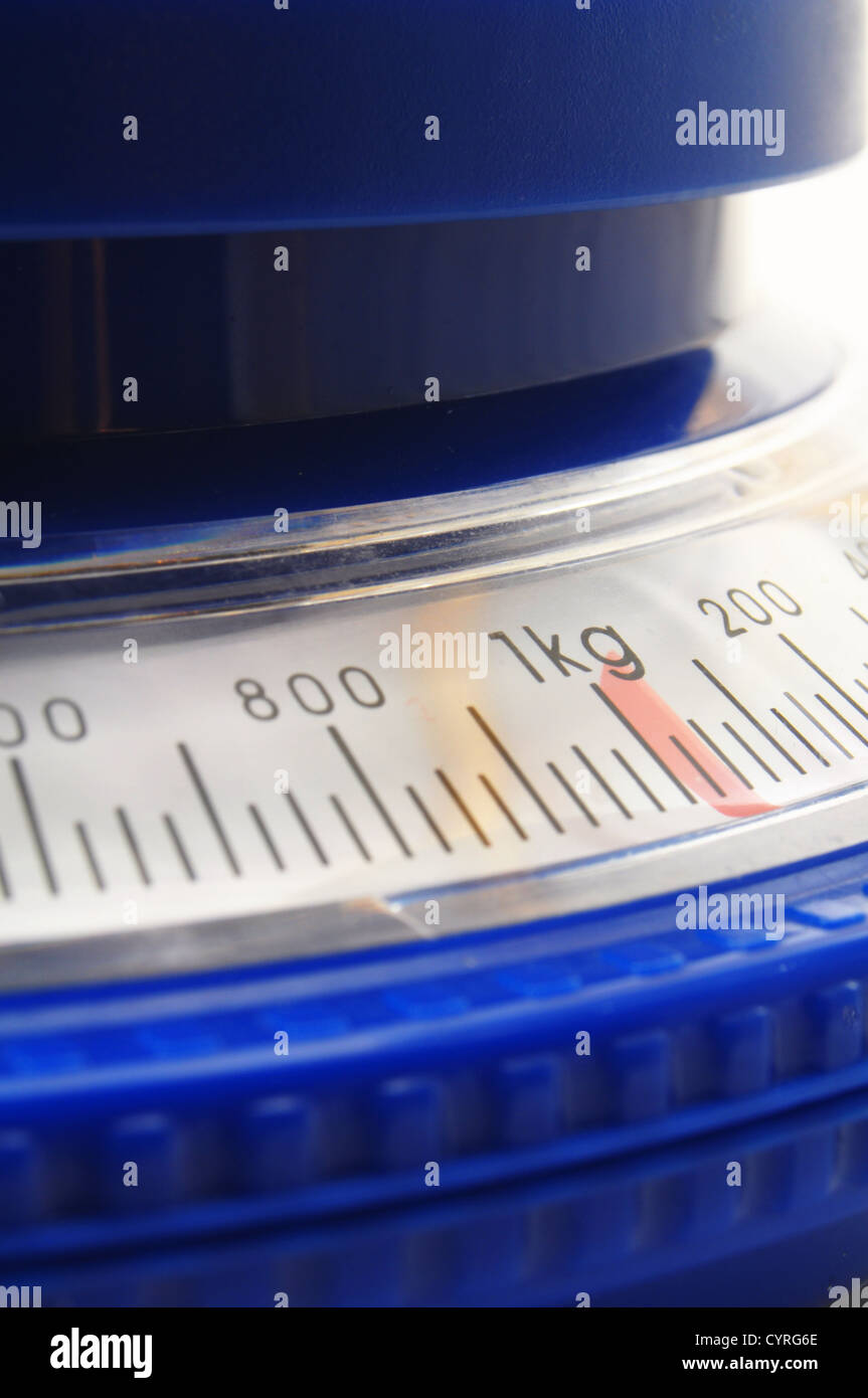 blue kitchen scales or balance showing cooking concept Stock Photo - Alamy