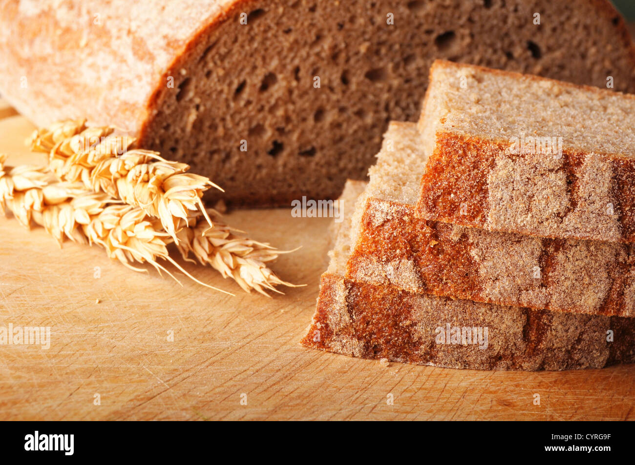 bread on wood surface showing food or bakery concept Stock Photo - Alamy