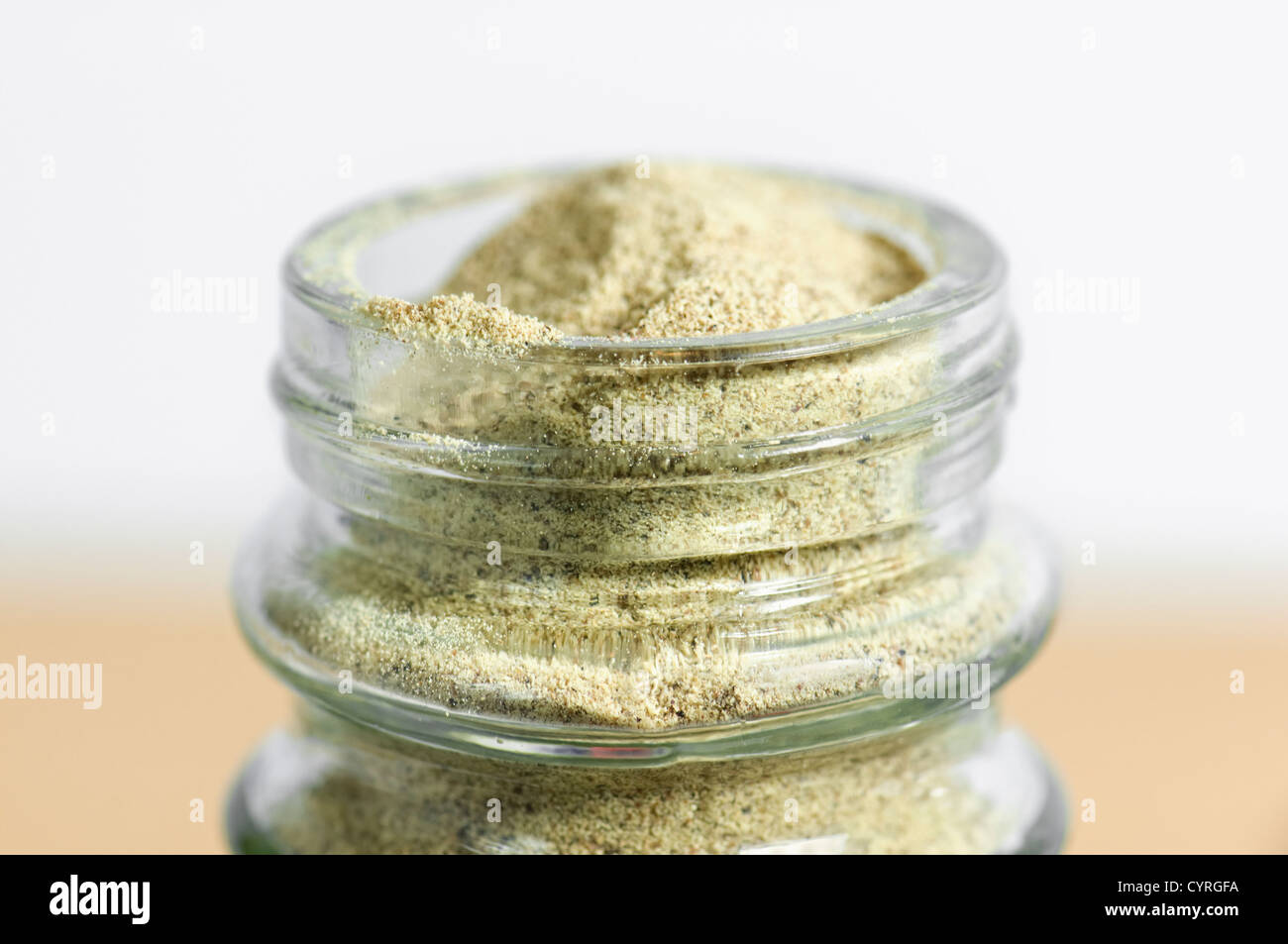 Open jar of ground white pepper Stock Photo - Alamy
