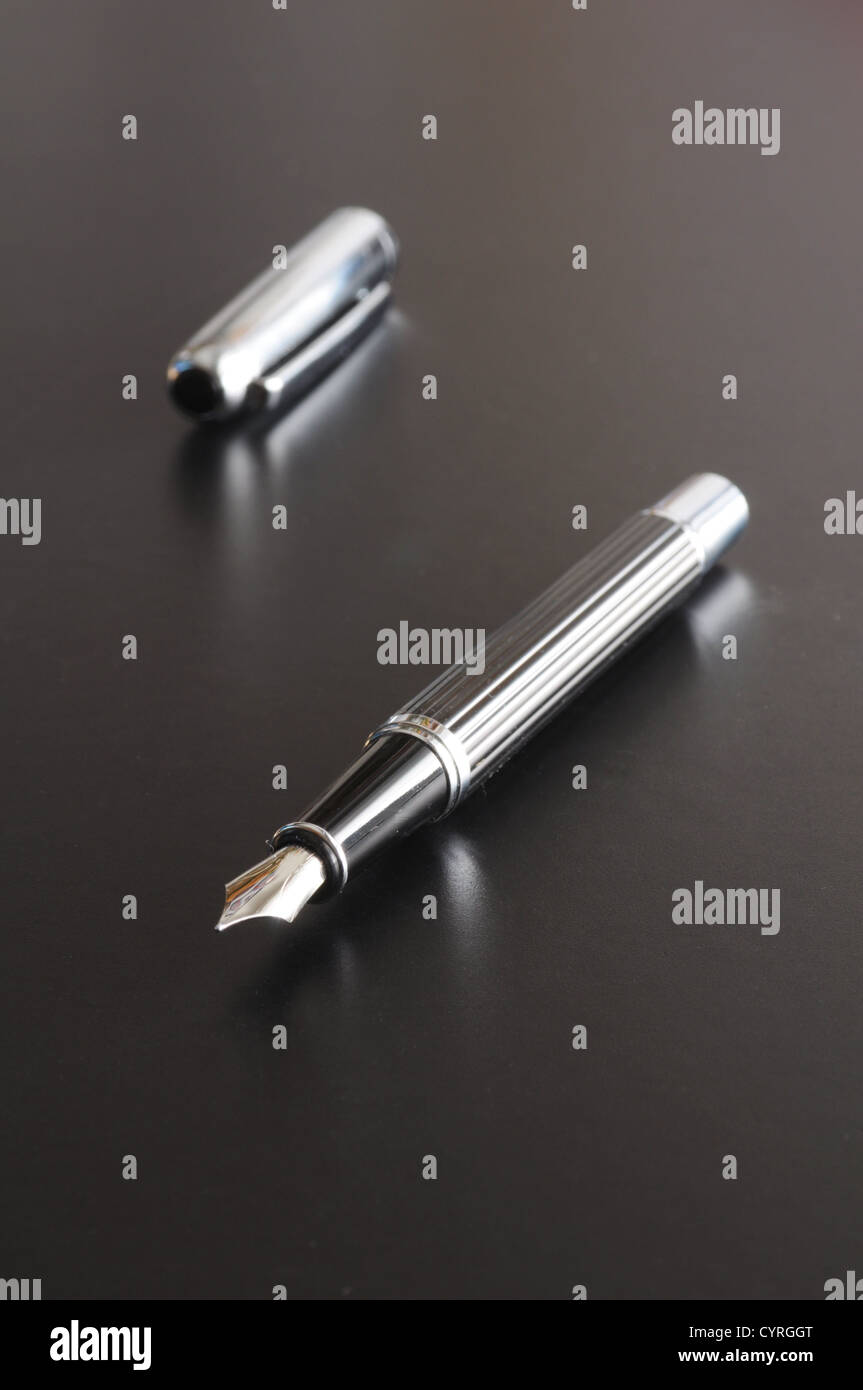 pen showing communication contact us or mail concept on black ...