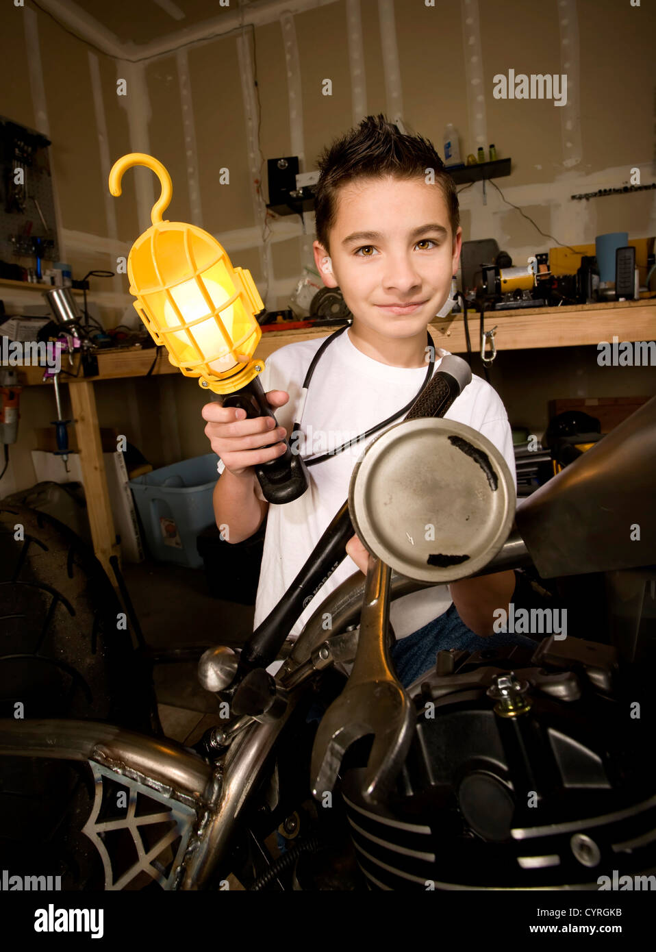 Silly Young Boy Mechanic Working on a Chopper Motorcycle Stock Photo ...