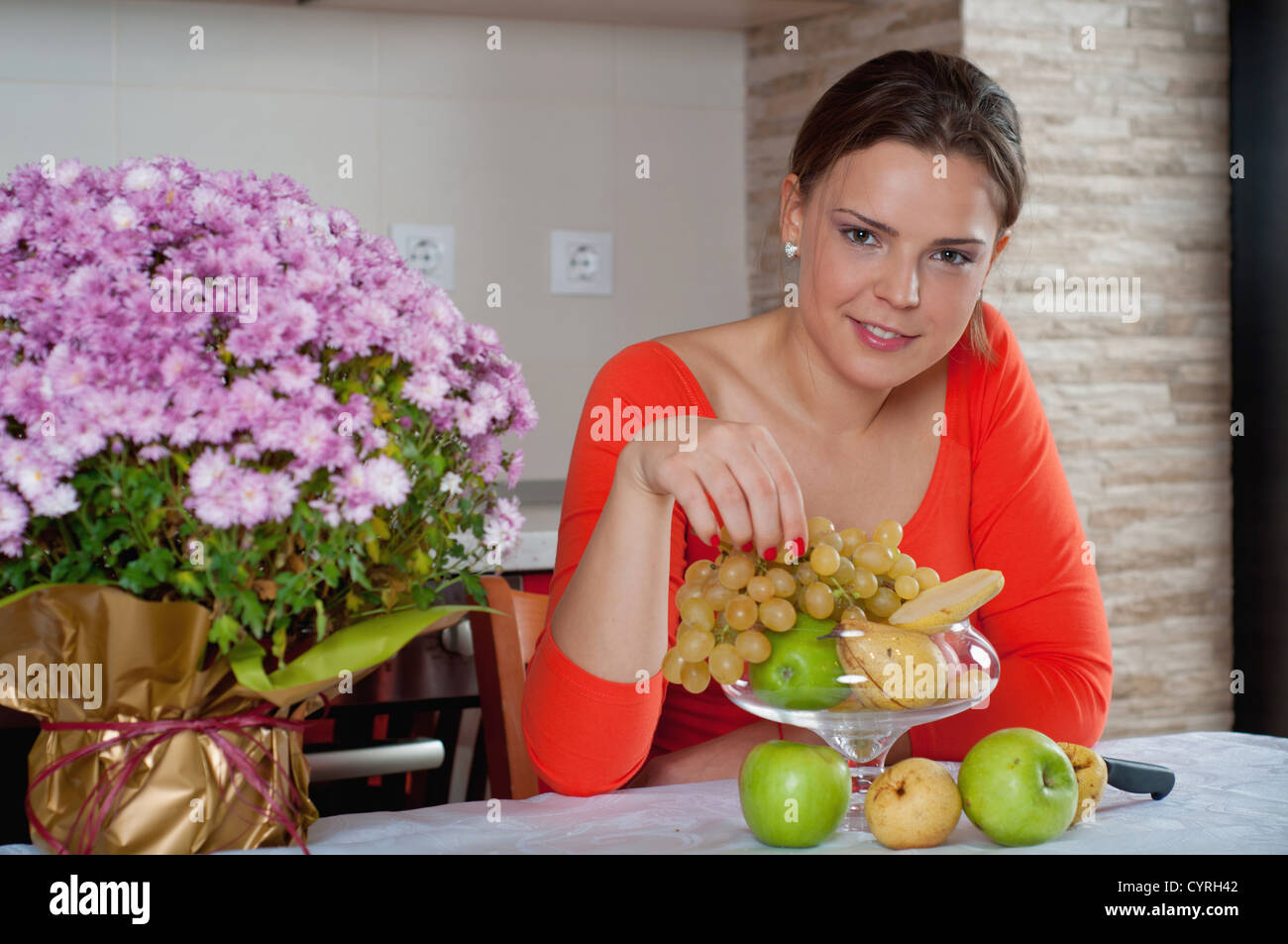 young woman eating fruits Stock Photo - Alamy