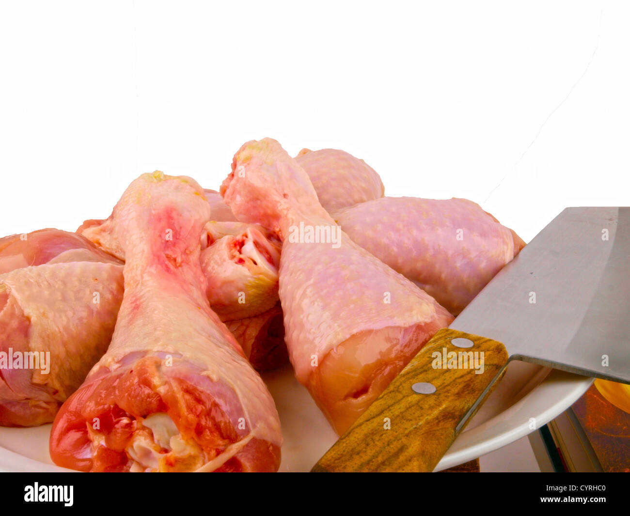 Fresh raw chicken legs. Close up on white background Stock Photo - Alamy