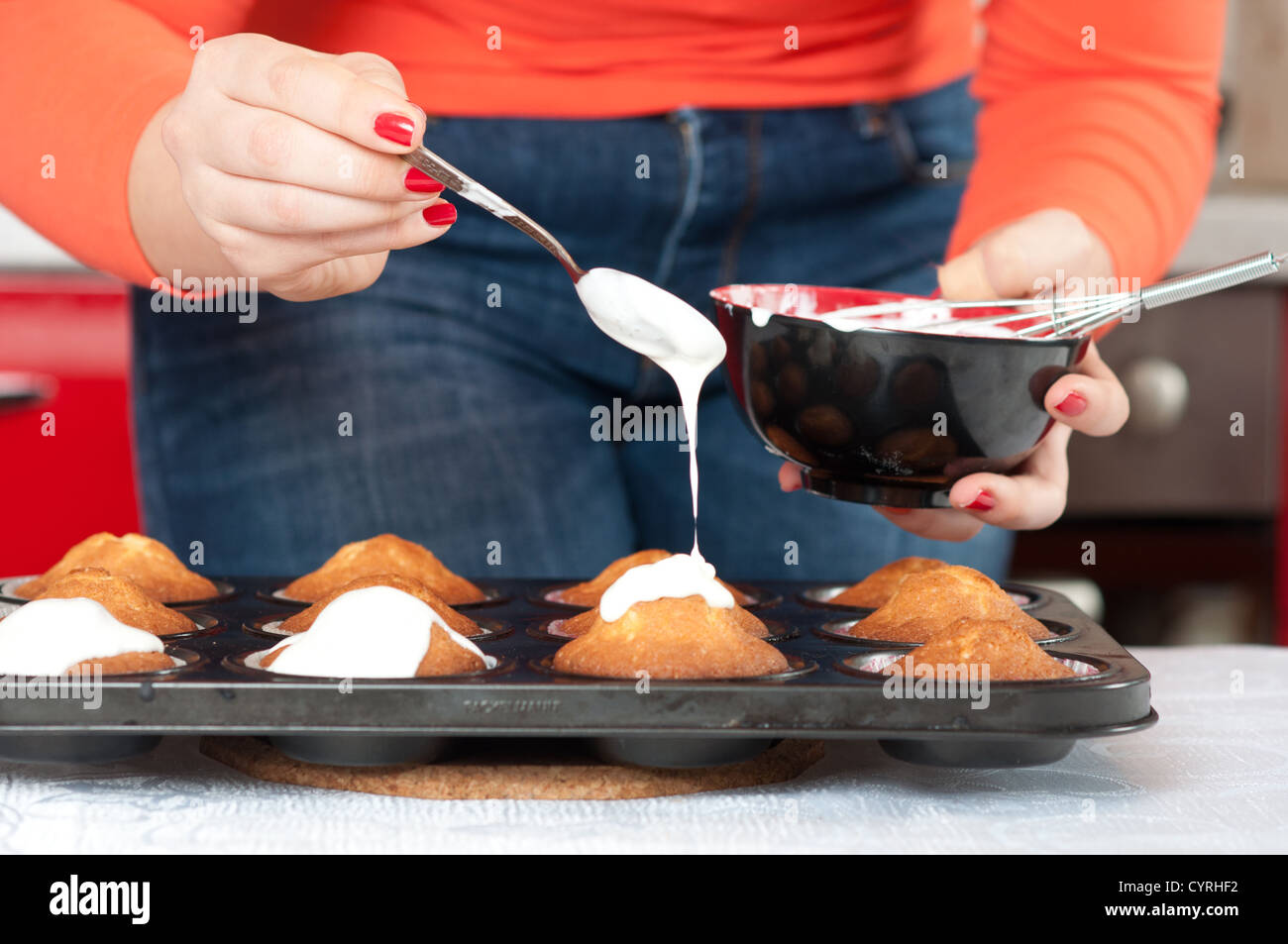 young woman in the kitchen making muffins Stock Photo - Alamy