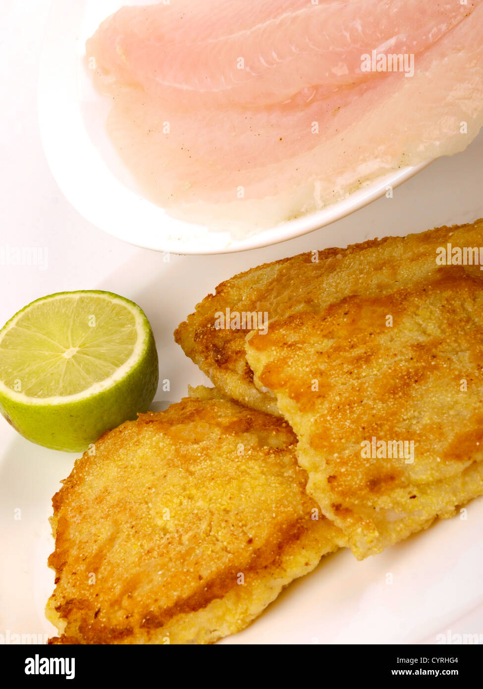 Fish Filet with lemon. Close up on white background Stock Photo - Alamy
