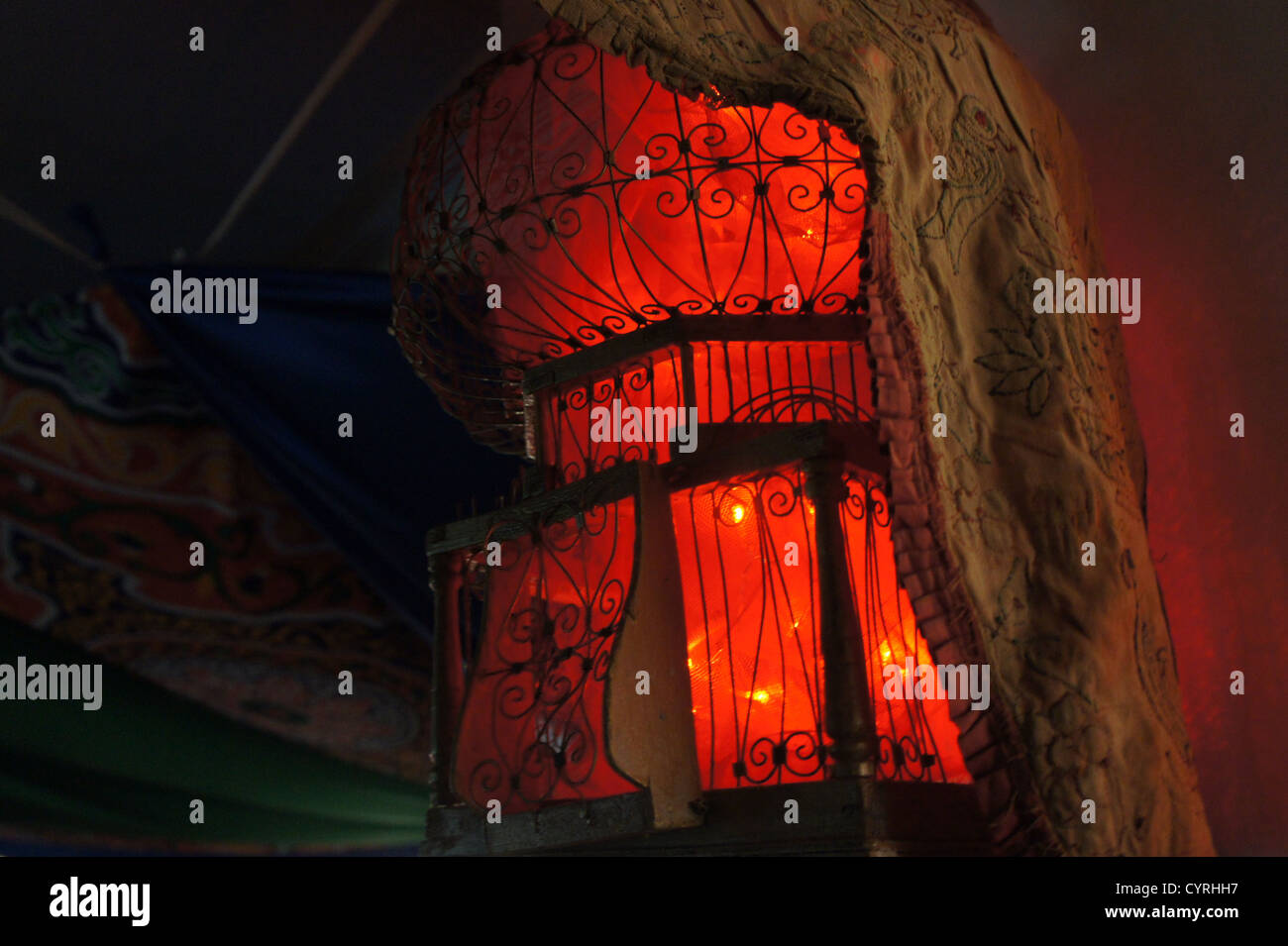An Arabic lantern glowing red, draped with fabric Stock Photo - Alamy
