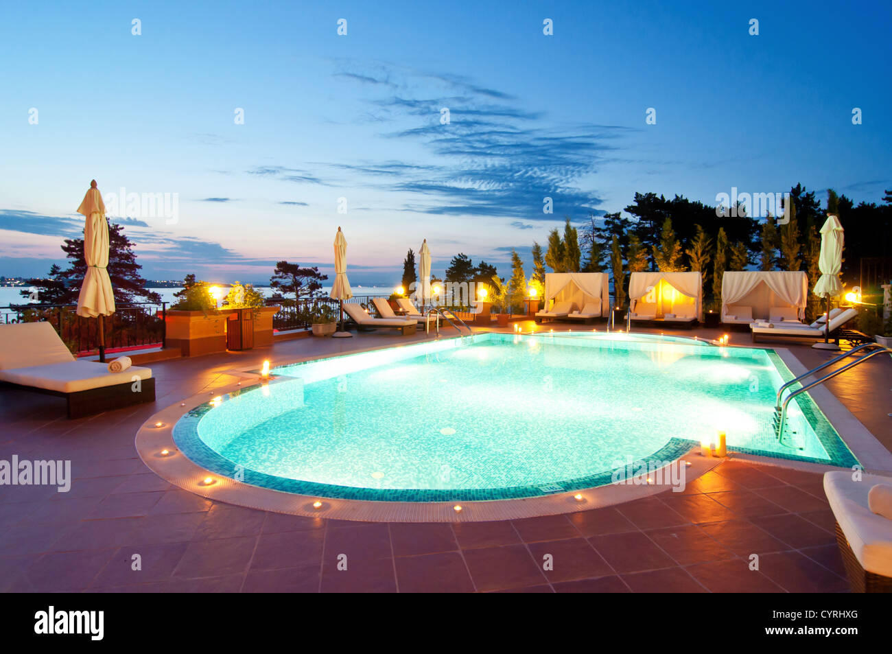 Swimming pool of luxury hotel at night Stock Photo - Alamy
