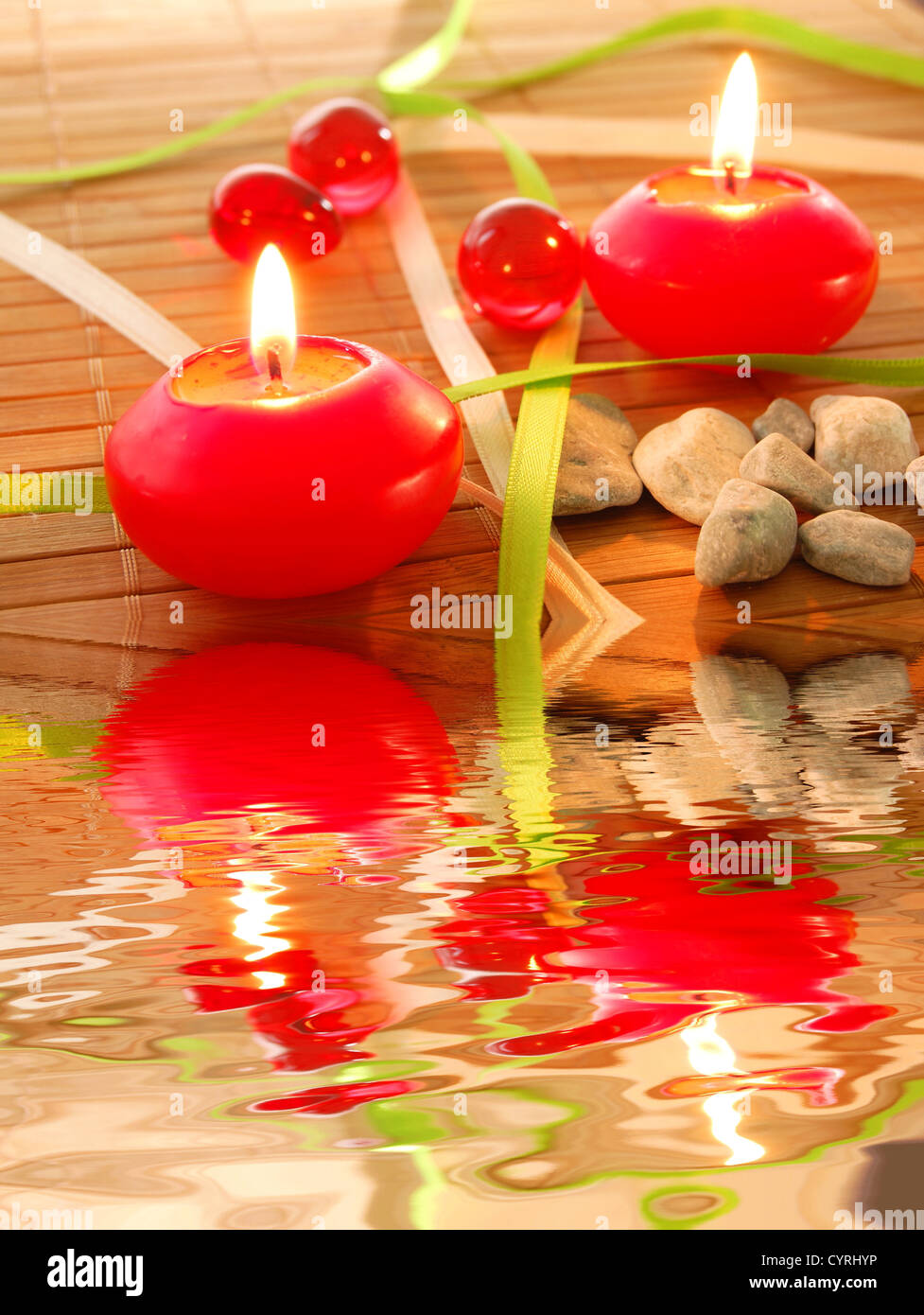 spa candle and water reflection showing zen concept Stock Photo - Alamy