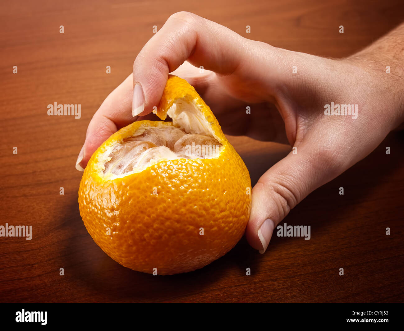 Woman peeling tangerine fresh fruit hi-res stock photography and images ...