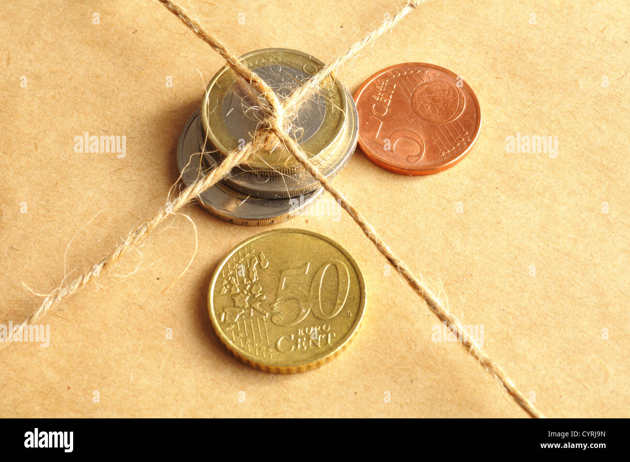 forwarding charges or shipping money concept with coins and parcel ...