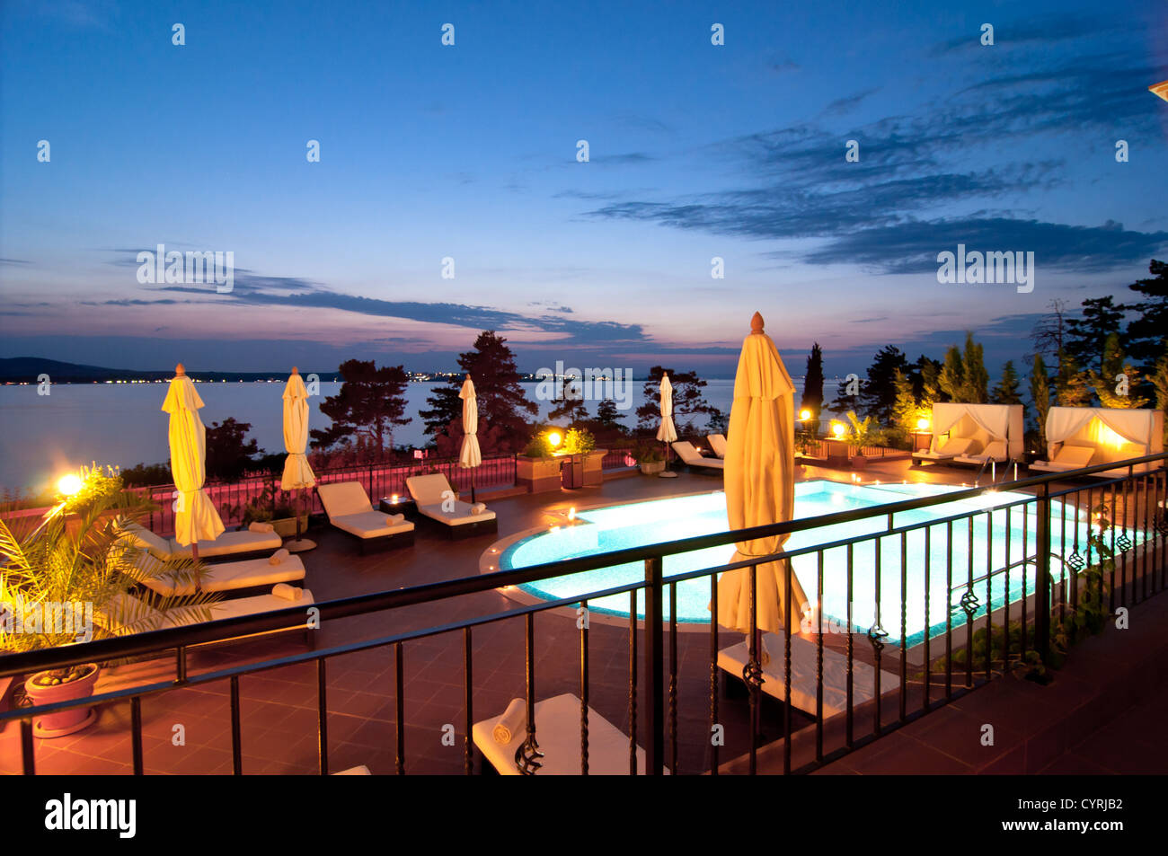 Swimming pool of luxury hotel at night Stock Photo - Alamy