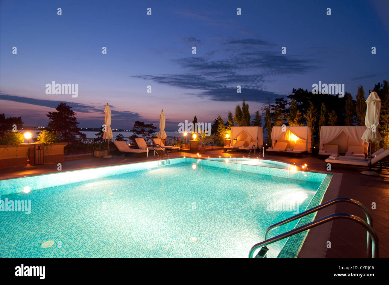 Swimming pool of luxury hotel at night Stock Photo - Alamy