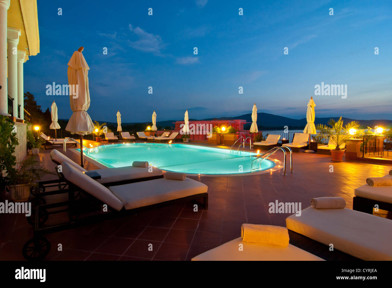 Swimming pool of luxury hotel at night Stock Photo - Alamy