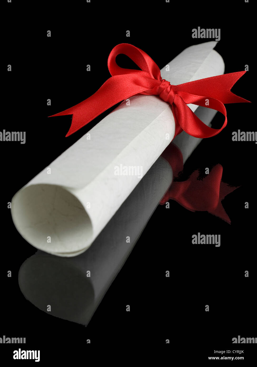 Diploma with a red silk ribbon, isolated on black background Stock ...